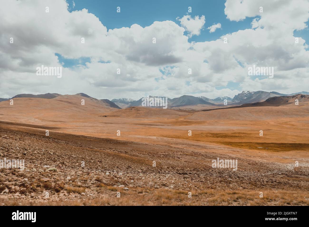 empty valley of Deosai National Park with vast mountain range in ...