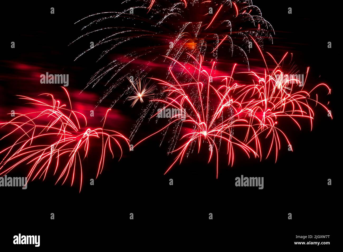 New Year's holiday fireworks. Bright beams of light from explosion of ...