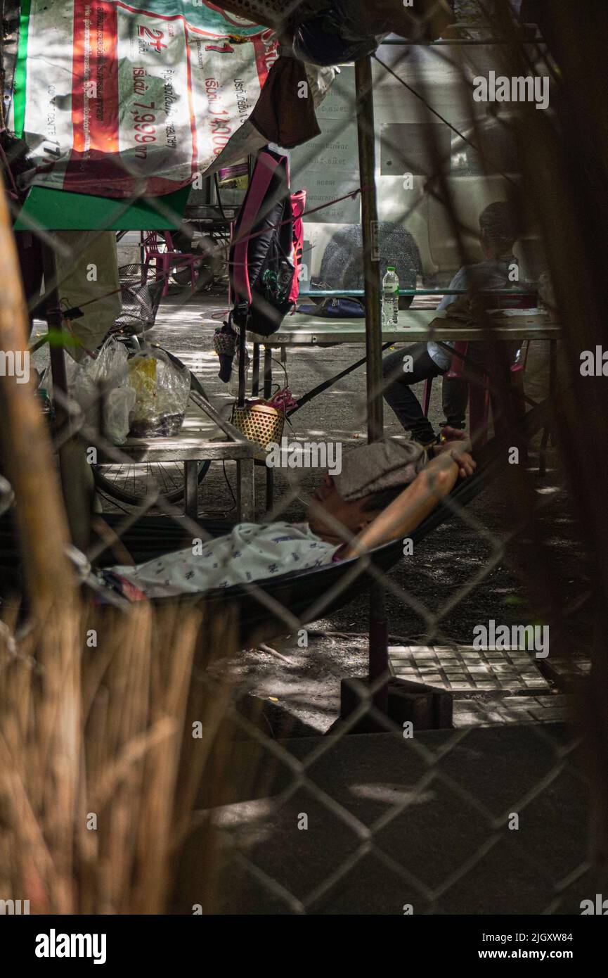 Homeless man sleeping in a temple Stock Photo - Alamy