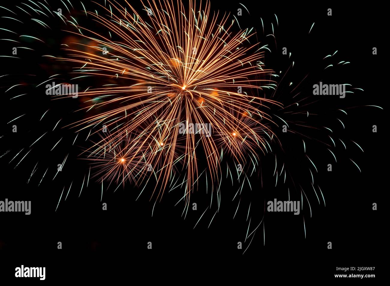 New Year's holiday fireworks. Bright beams of light from explosion of ...
