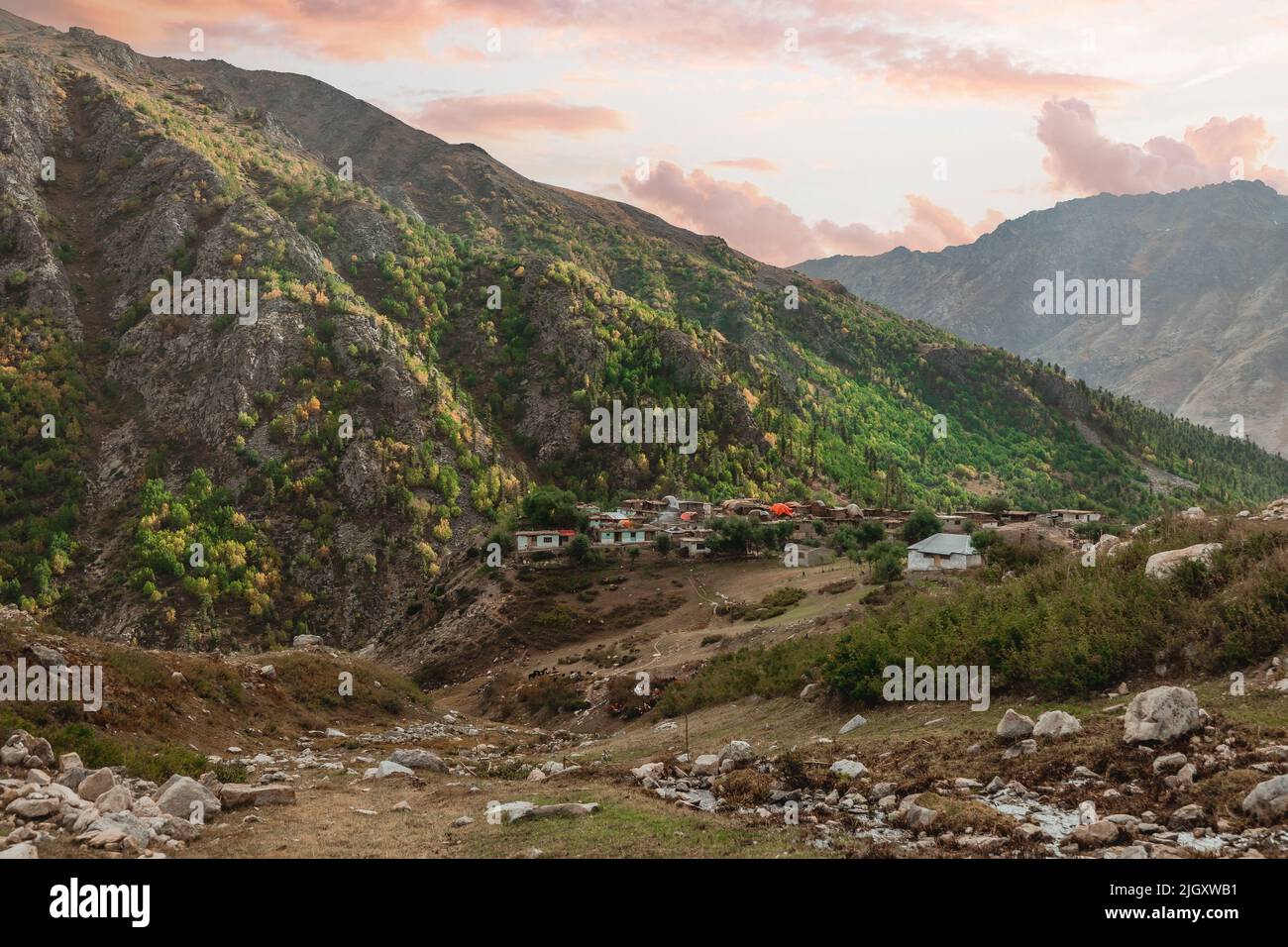 landscape of mountain village in summer along green hills of Astore ...