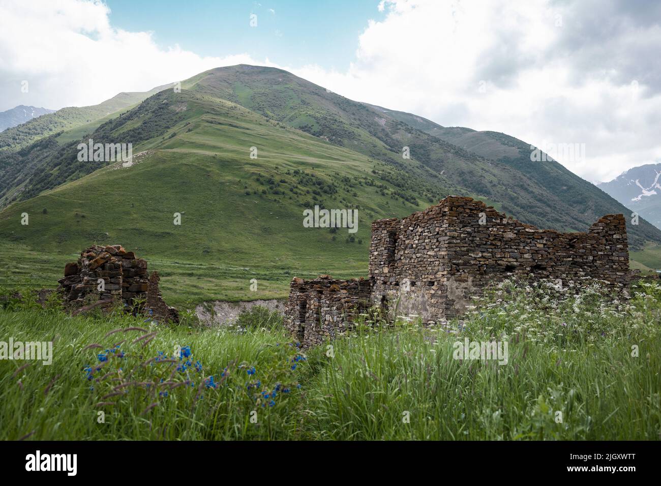 Ancient ruined tower in high mountains . North Ossetia Alania , Russia ...