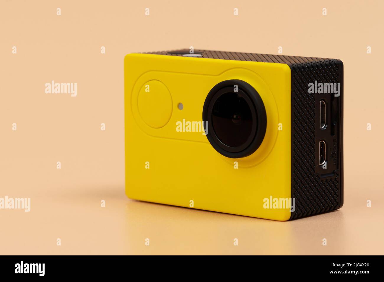 Small action camera with wide yellow close up view Stock Photo - Alamy