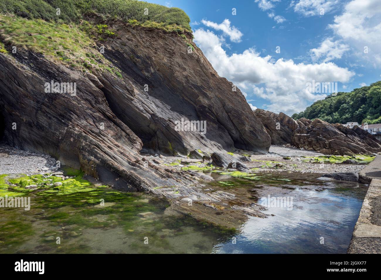 Exotic rock pools at Coombe Martin on the North Devon coast Stock Photo ...