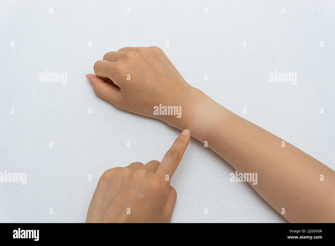 Watch marks on a woman's hand burned in the sun Stock Photo - Alamy