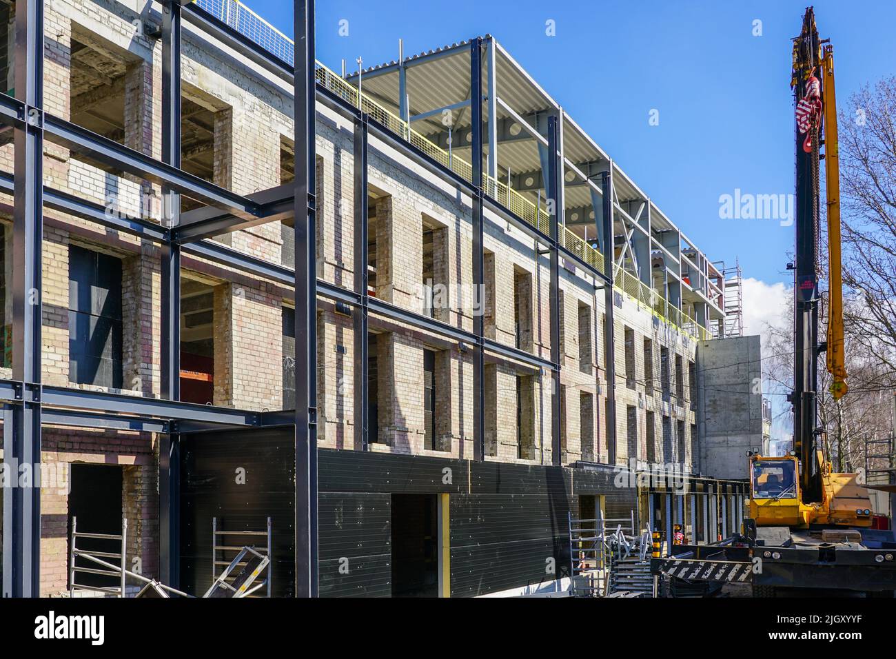 Reconstruction and modernization of an old brick building by expanding ...