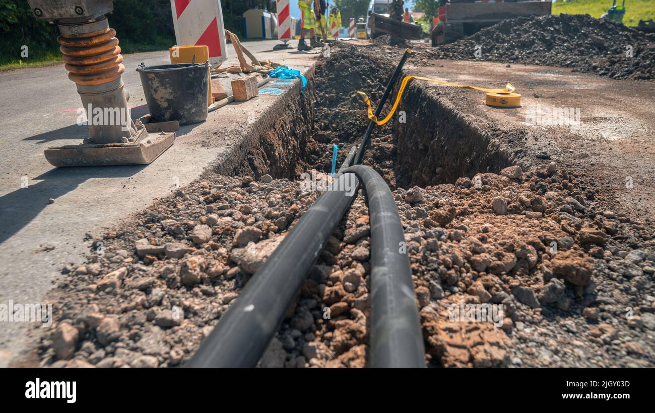 A construction site with a dug road for laying new water pipes Stock ...