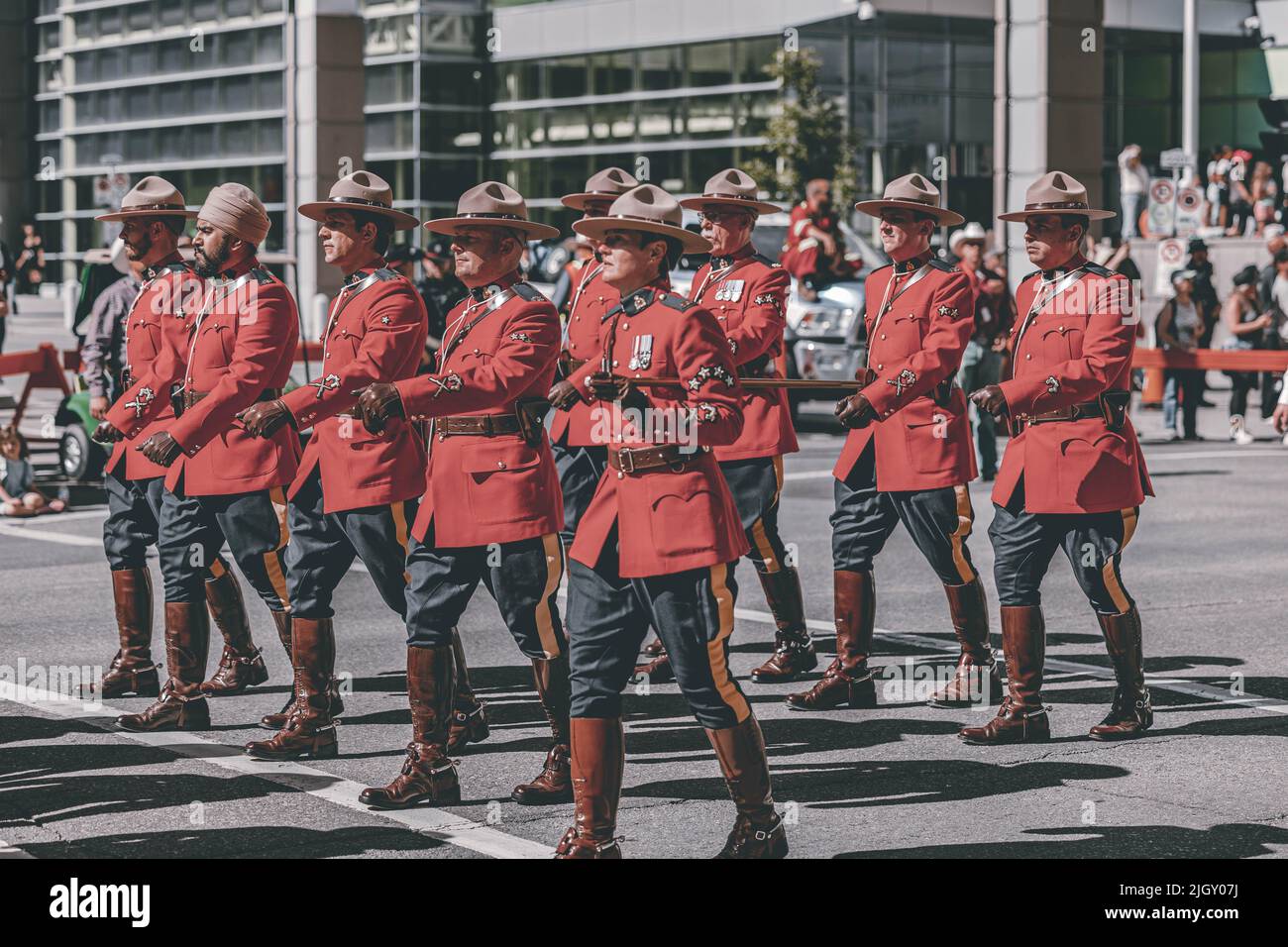 Royal Canadian Mounted Police march at the Calgary Stampede Parade ...