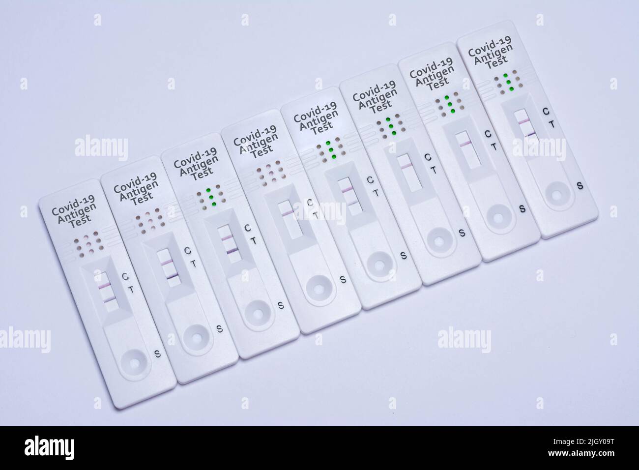 Coronavirus antigen test in a diagonal row, with positive and negative ...