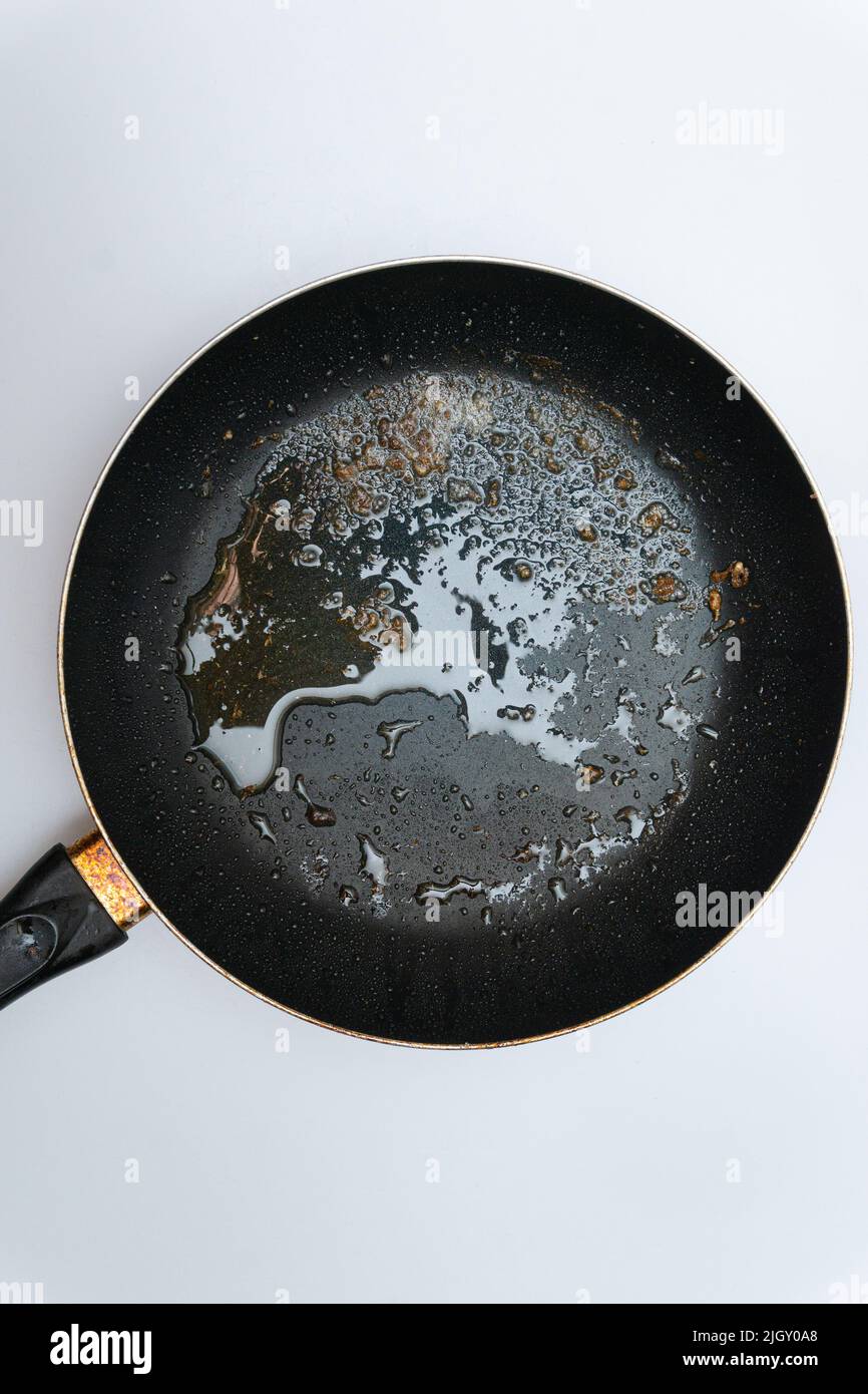 Old frying pan with a lot of grease Stock Photo - Alamy