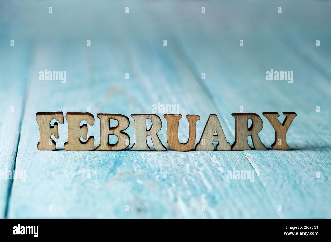 The month of January is large on a blue background. The names of the ...