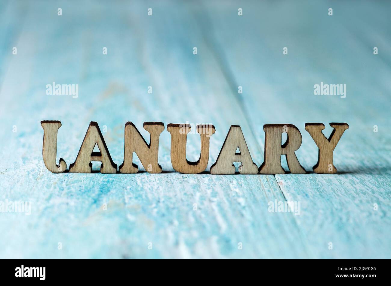The month of January is large on a blue background. The names of the ...