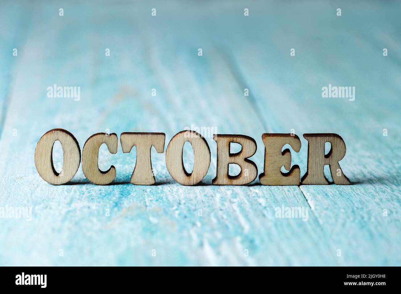 The month of January is large on a blue background. The names of the ...