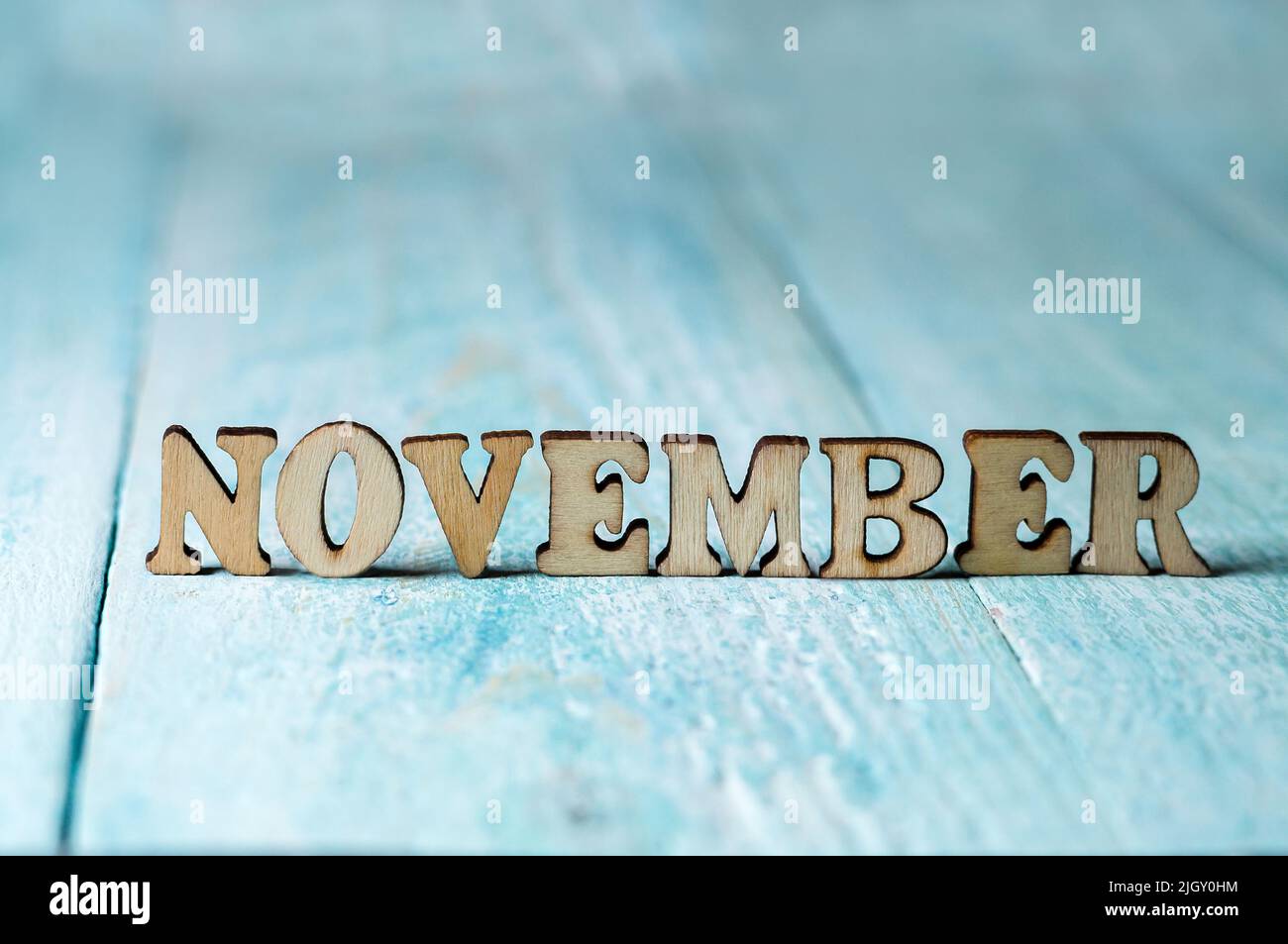 The month of January is large on a blue background. The names of the ...