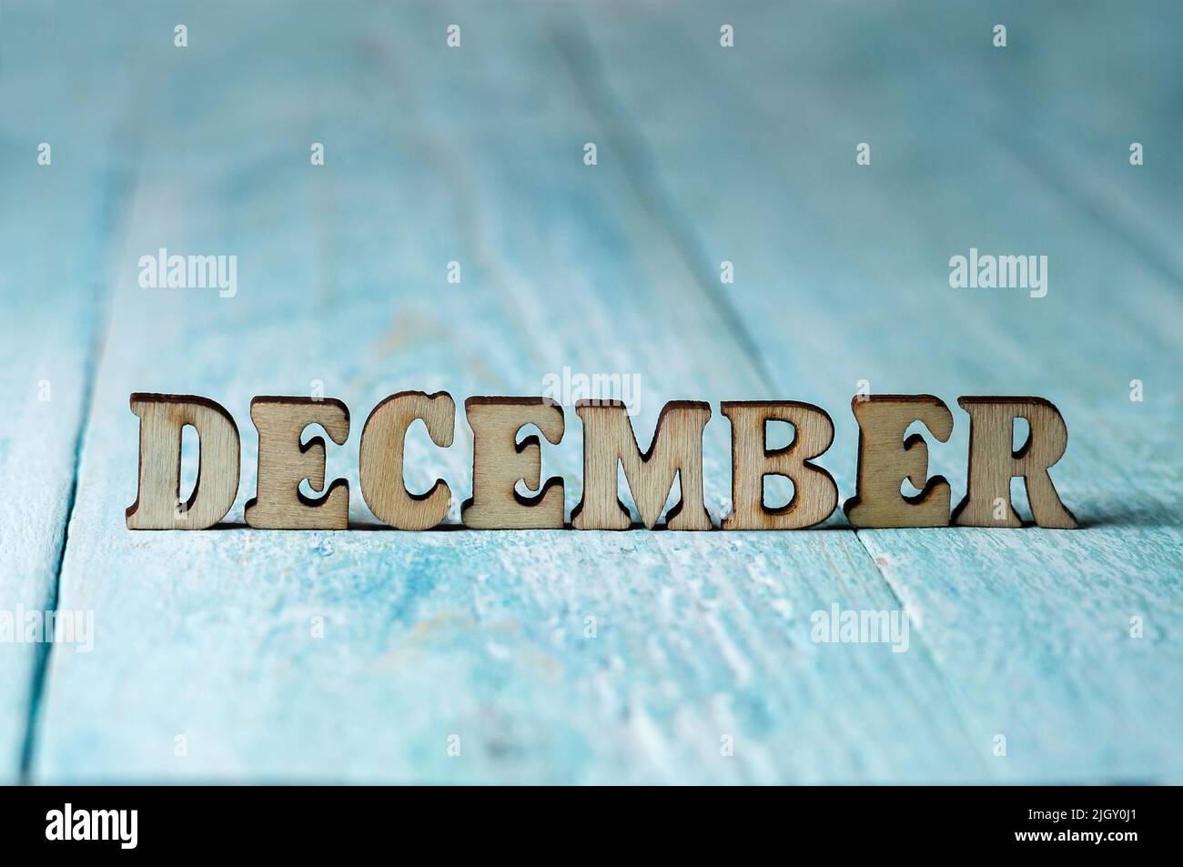 The month of January is large on a blue background. The names of the ...