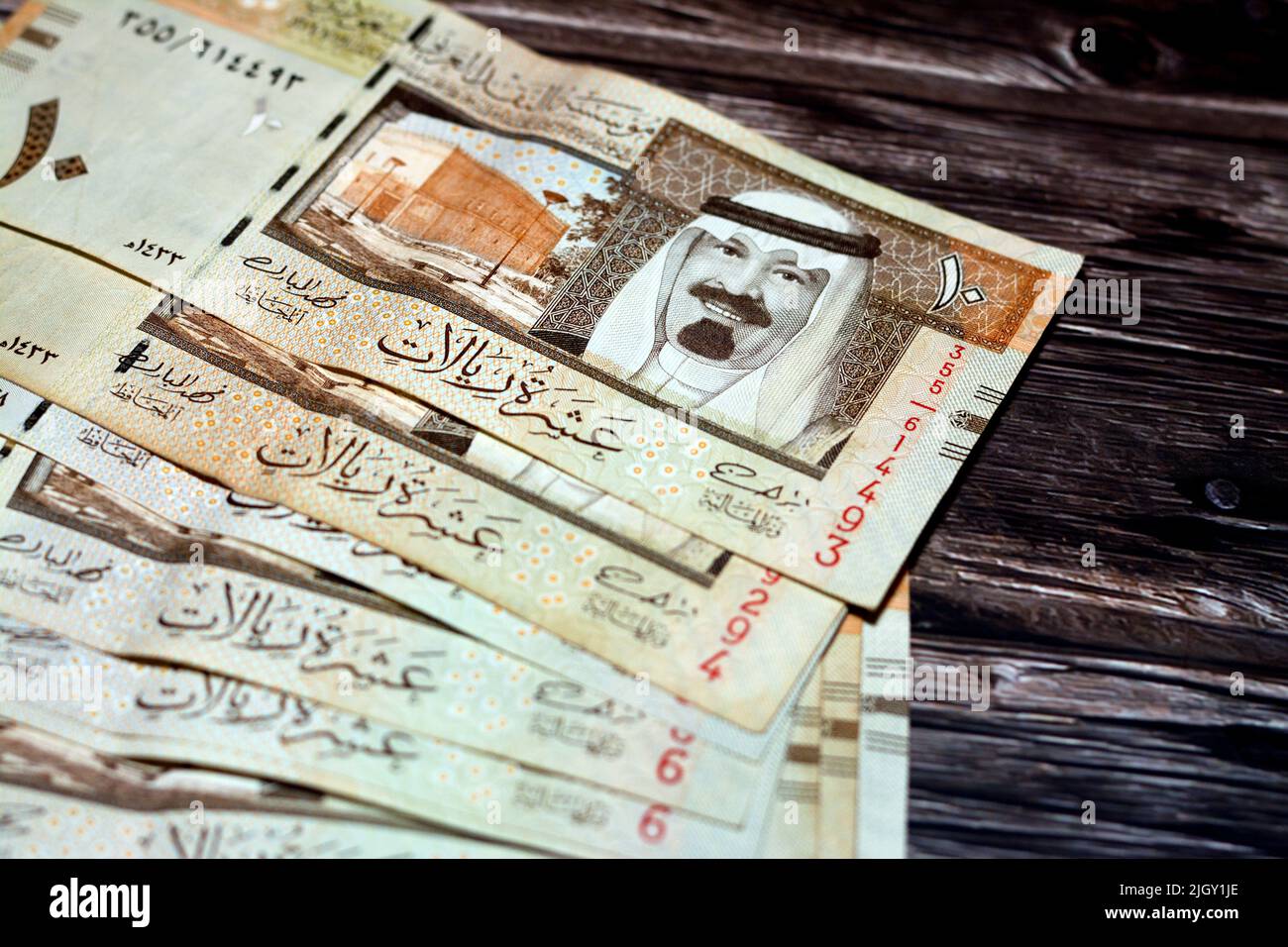 Pile of Saudi Arabia 10 SAR ten Saudi riyals cash money banknote with ...