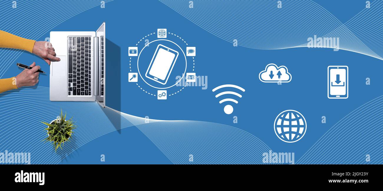 Top view of hands using laptop with symbol of mobile apps concept Stock ...