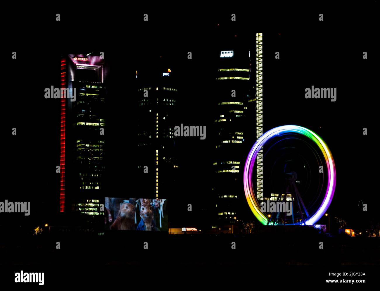 Night photography in the five towers area in Madrid with an illuminated ...