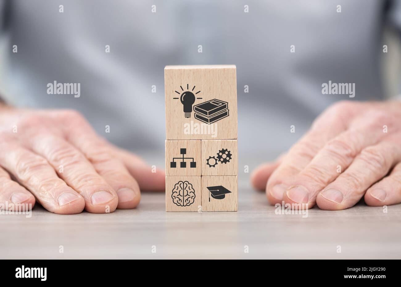 Wooden blocks with symbol of knowledge concept Stock Photo - Alamy