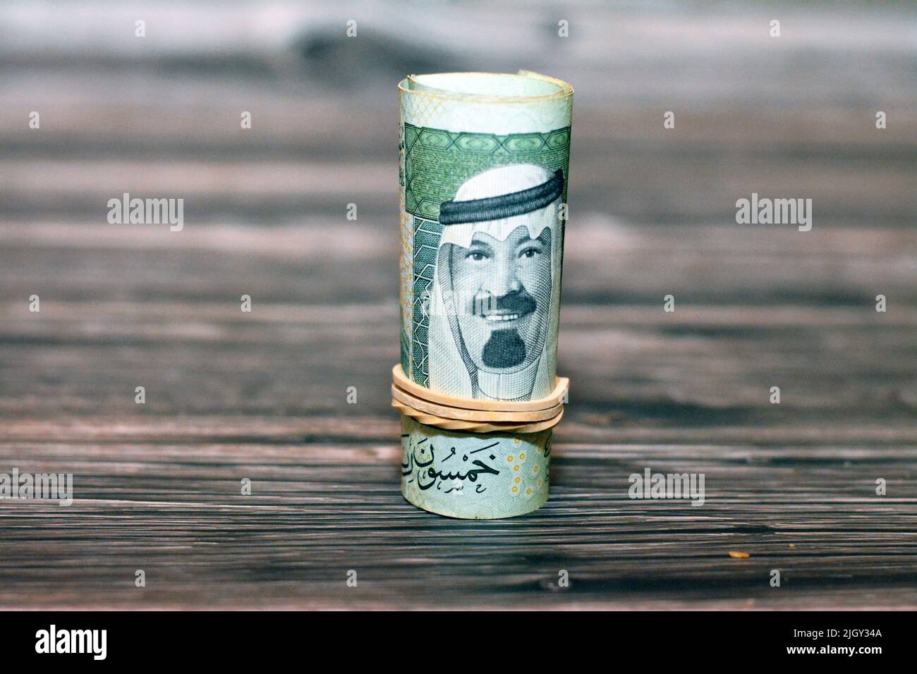 50 SAR fifty Saudi riyals cash money banknote bills rolled up with ...