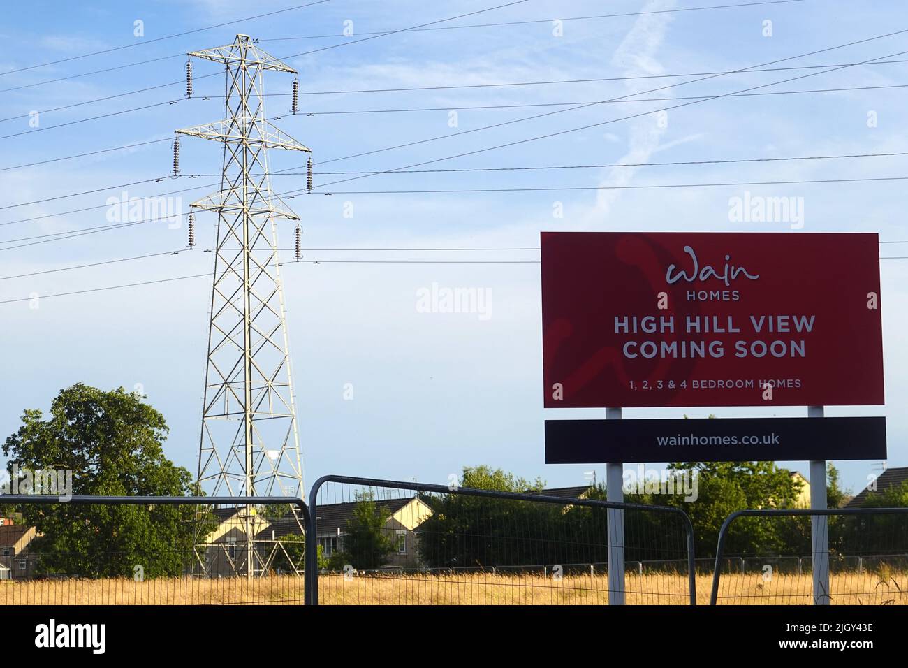 A building site next to a pylon Stock Photo - Alamy