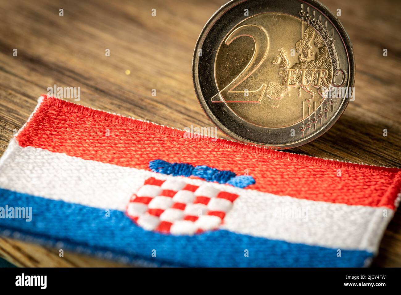 Croatian flag next to the euro coin. Croatia's accession to the Euro ...