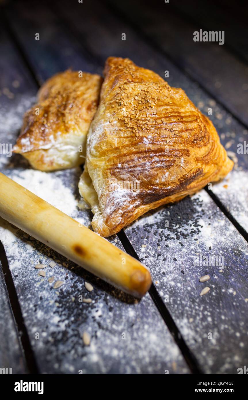 delicious crispy puff pastry samsa on a dark background Stock Photo - Alamy