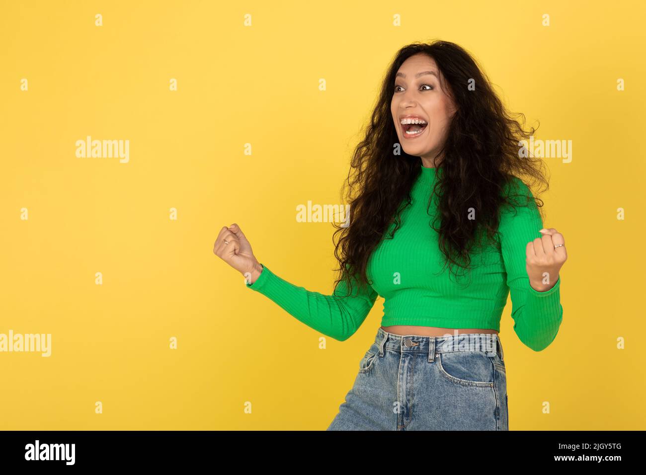 Emotional Middle Eastern Lady Gesturing Yes Looking Aside, Yellow ...