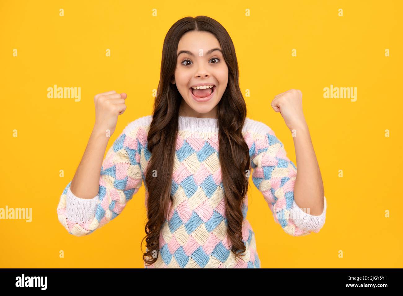 Amazed teen girl. Excited expression, cheerful and glad. Joy, victory ...