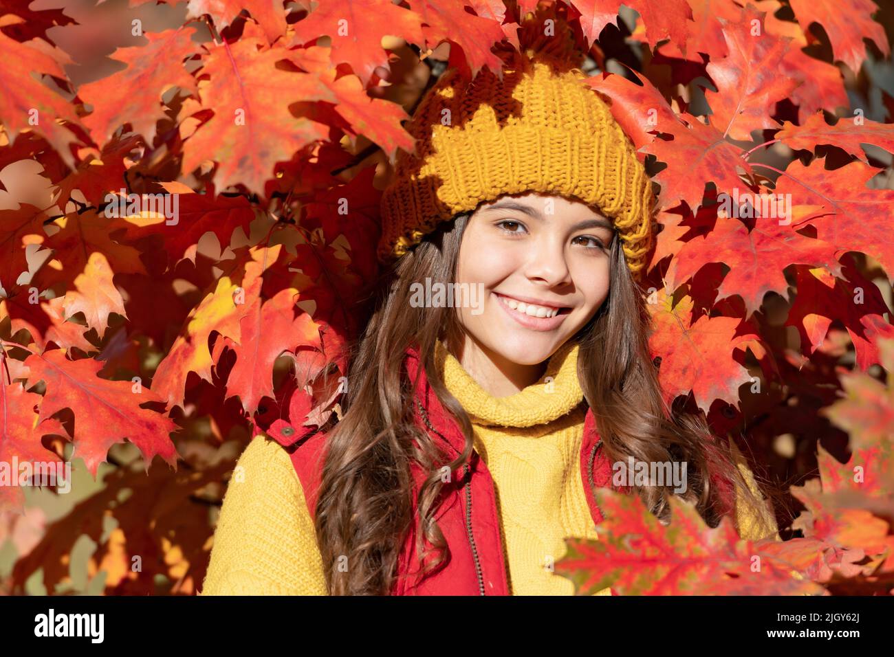 Child girl in autumn fall park outdoor, kids fun face. happy kid in hat ...