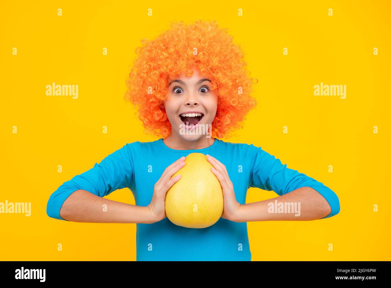 Summer fruits. Teenager child girl hold citrus fruit pummelo or pomelo ...
