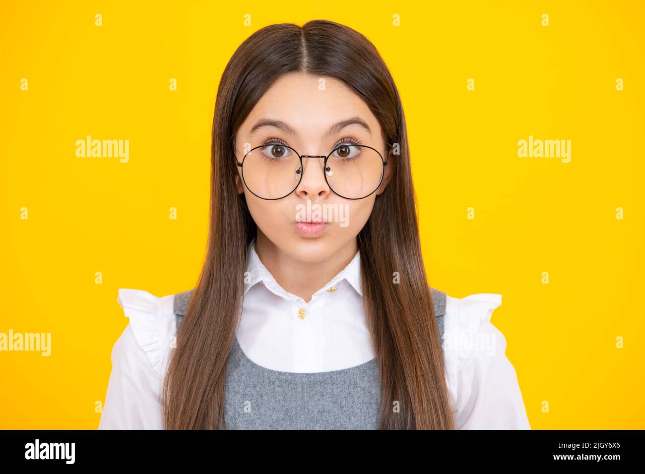 Studio shot of emotional adorable little girl surprised and shocked ...