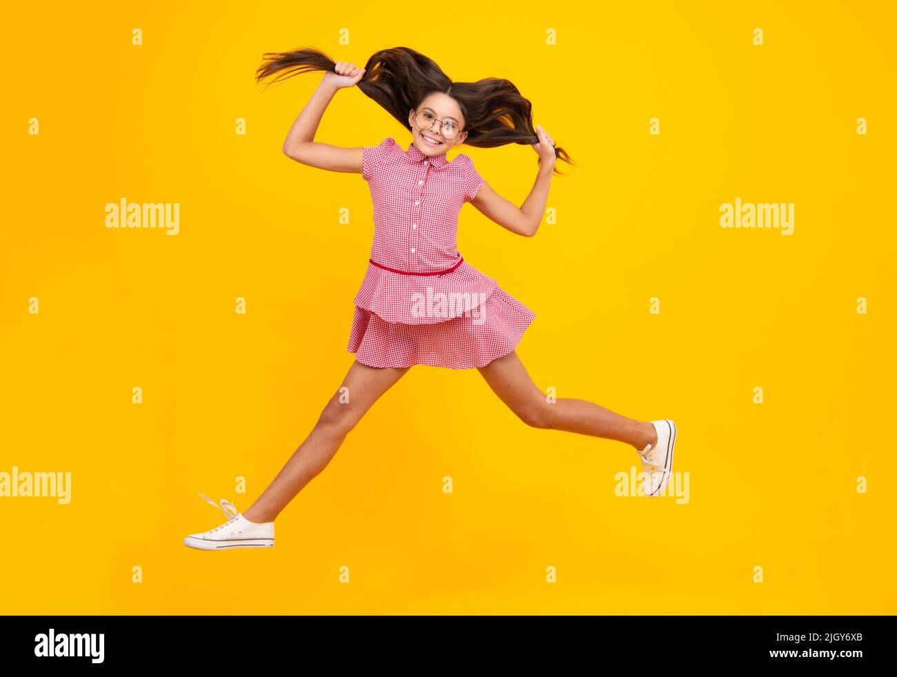 Happiness, activity and child. Teenager girl jumping on isolated ...