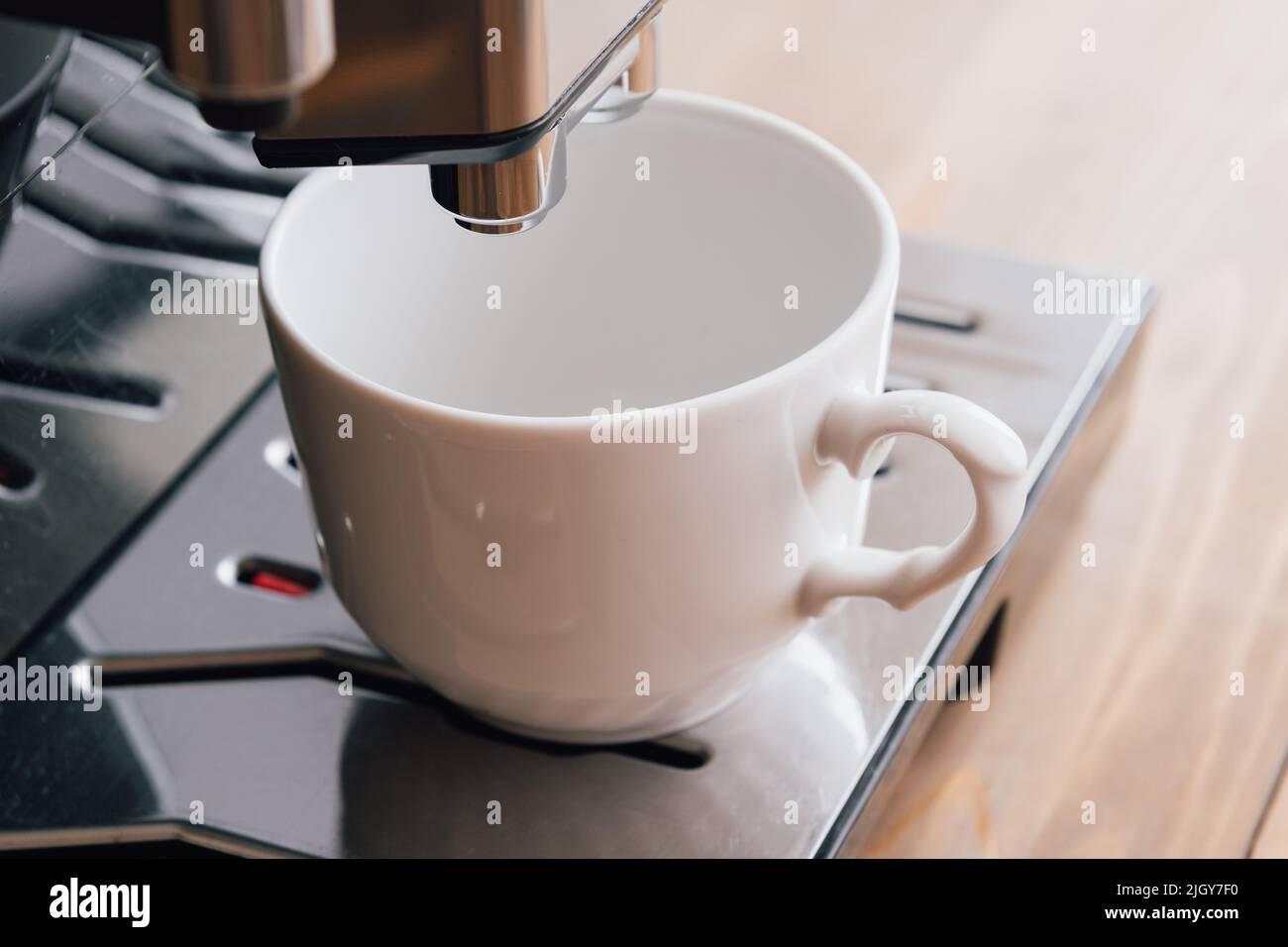 wooden desk and stylish coffee machine on it Stock Photo - Alamy