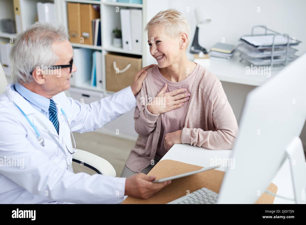 Female patient holding stethoscope chest hi-res stock photography and ...