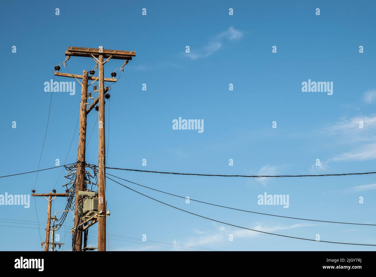 External transformer on wooden poles connected into electric energy on ...