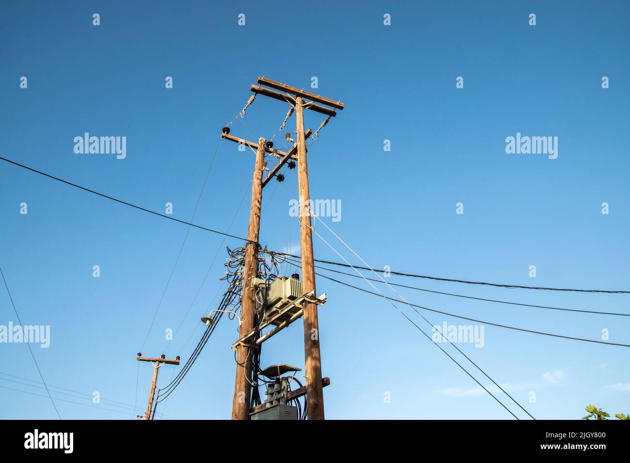External transformer on wooden poles connected into electric energy on ...