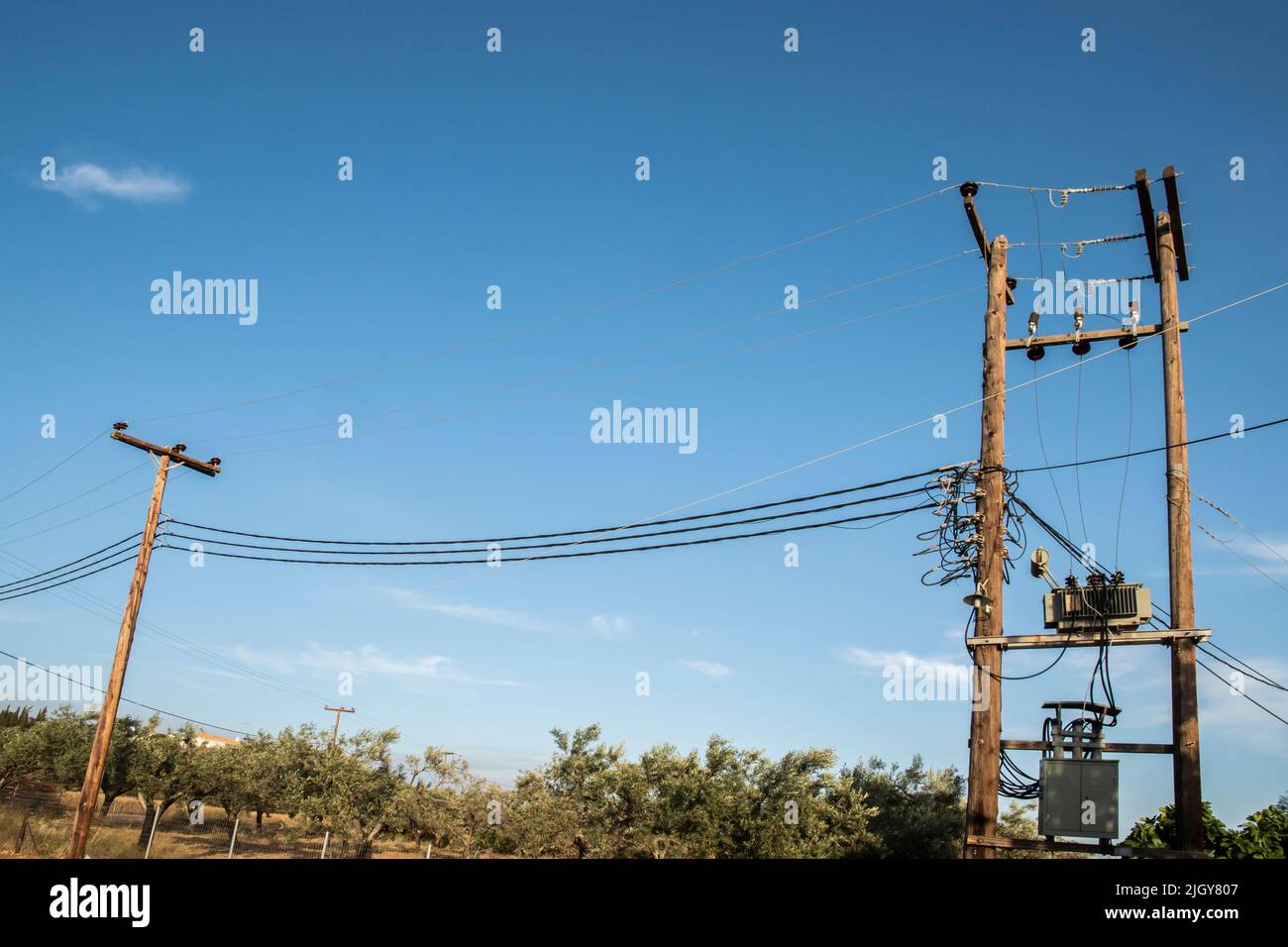 External transformer on wooden poles connected into electric energy on ...