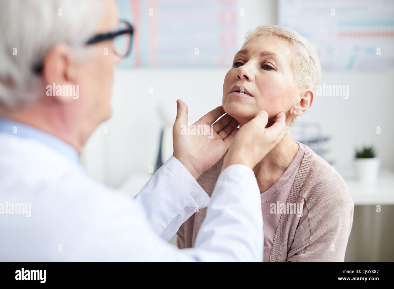 Doctor checking lymph nodes hi-res stock photography and images - Alamy