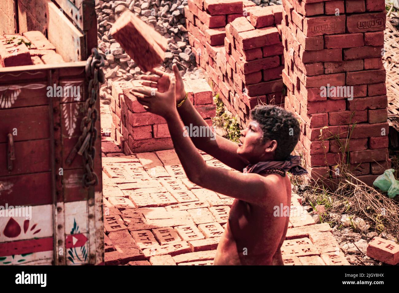 worker catching brick Stock Photo - Alamy