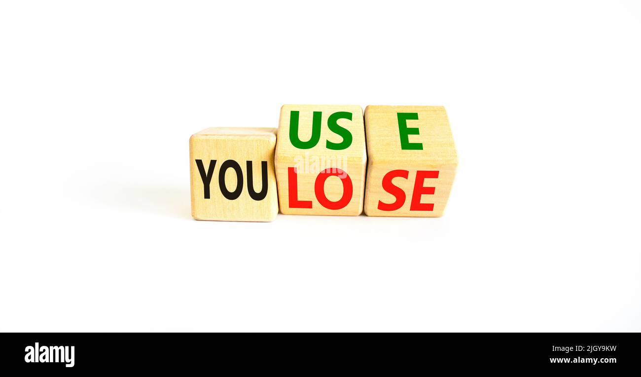 You use or lose it symbol. Concept words You use and You lose on wooden ...