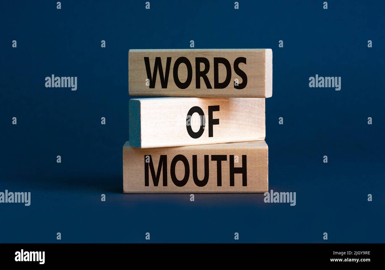 Words of mouth symbol. Concept words Words of mouth on wooden blocks on ...