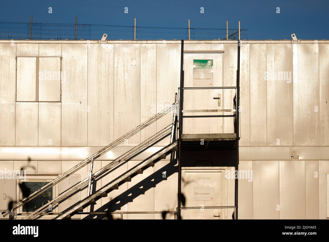 The sun reflecting on a construction site cabin in Leeds Stock Photo ...