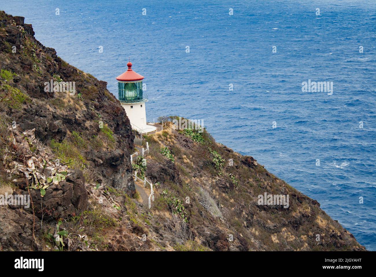 A lighthouse on a hill overlooking beautiful Oahu island Stock Photo ...
