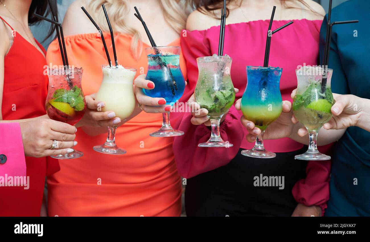 Different cocktails in the hands of girls girlfriends at a party Stock ...
