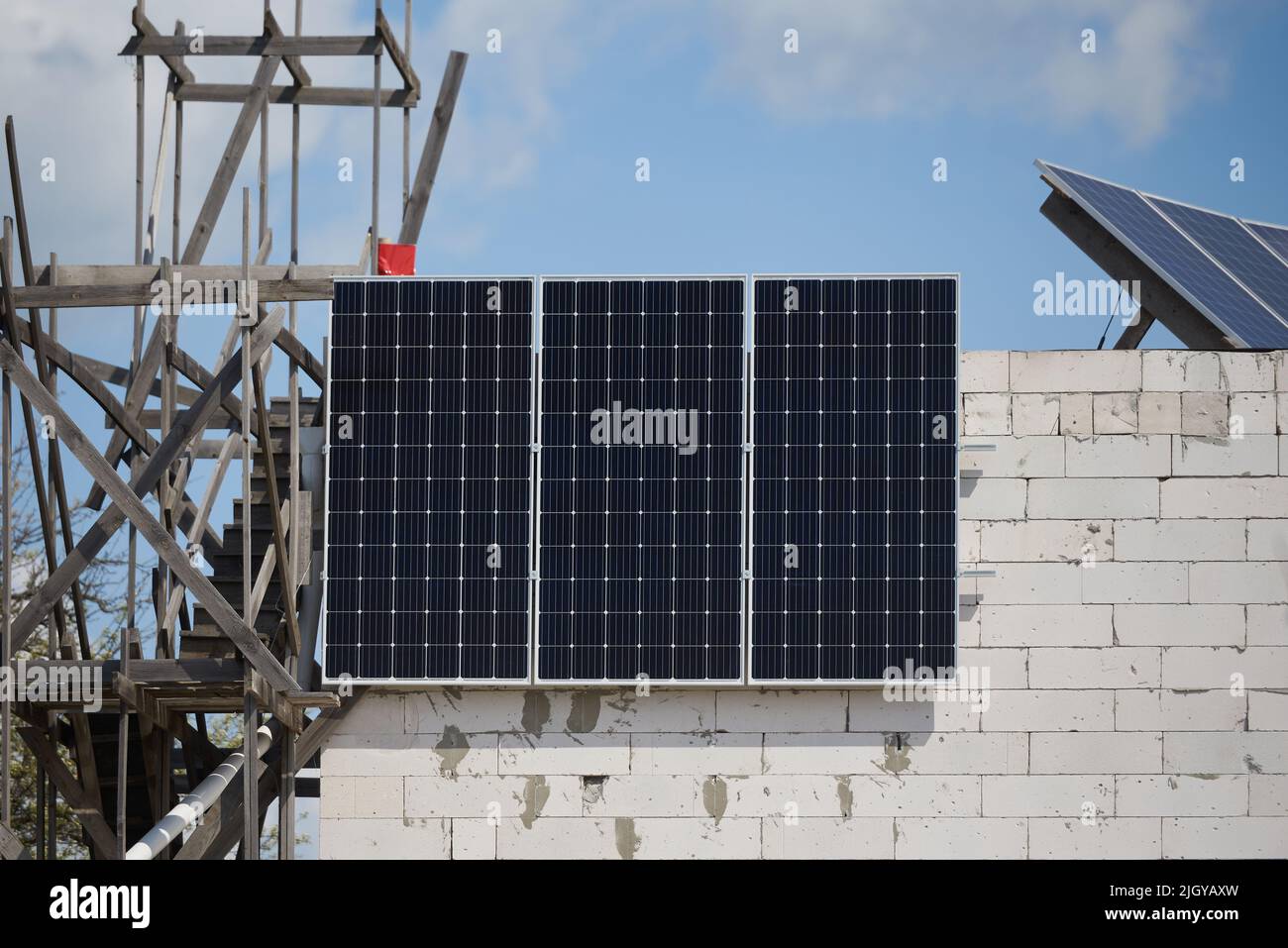 Installation of solar panels house under construction, green energy ...