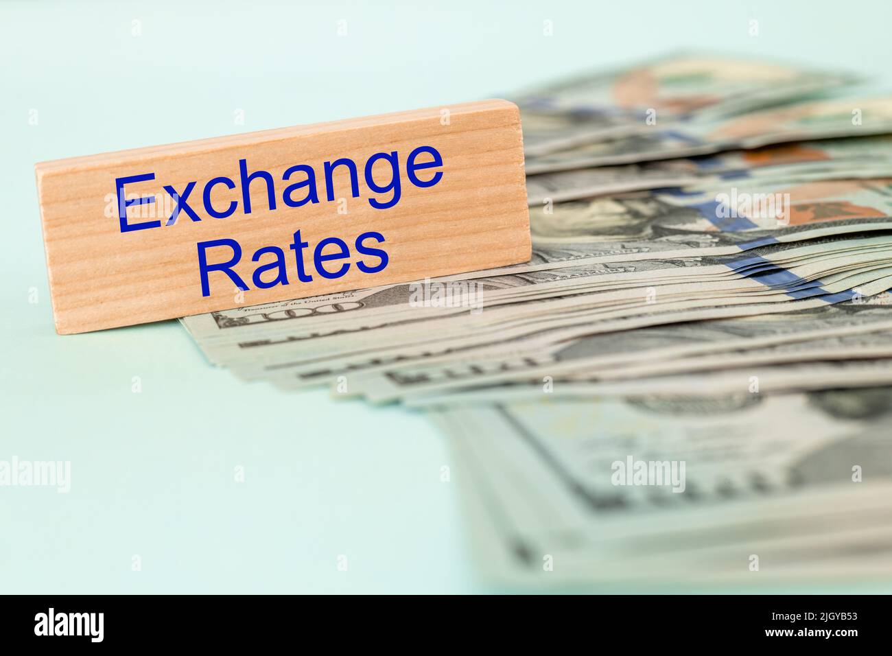 Exchange rates, The inscription on a wooden plate standing on a stack ...