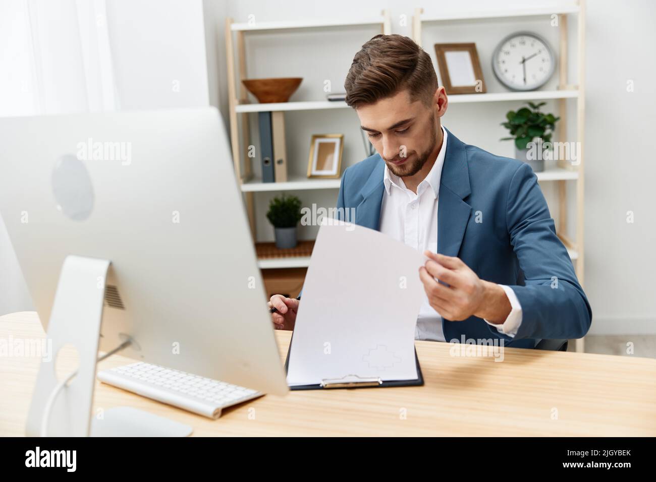 businessmen sitting at the computer work boss documentation Gray ...