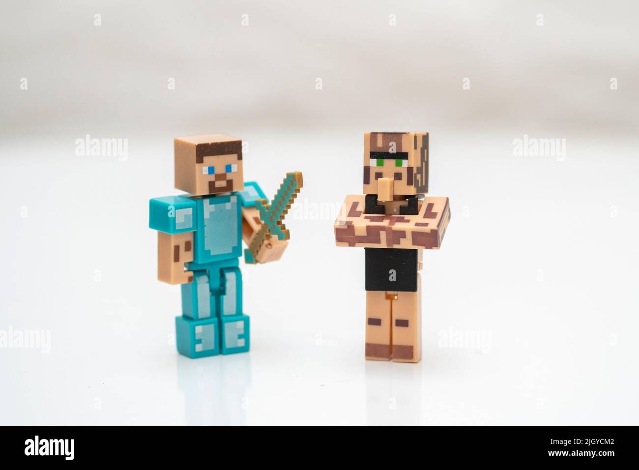 A close-up shot of Minecraft action figures on a white background Stock ...