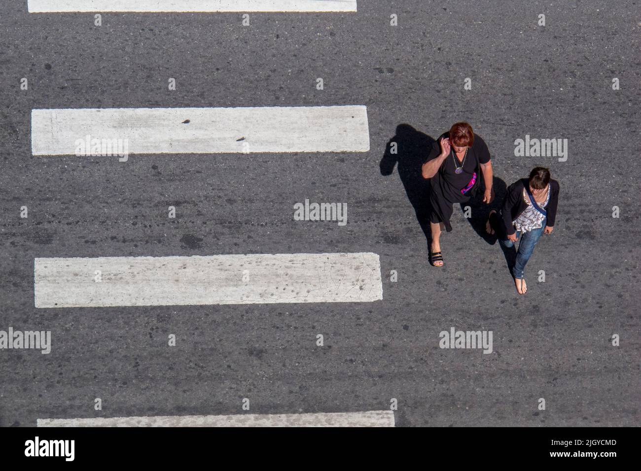 A top view of two women crossing the street Stock Photo - Alamy